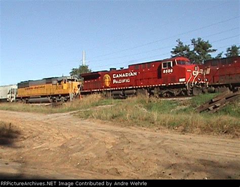 Cp 8556 And An Ex Up Cnw Sd50