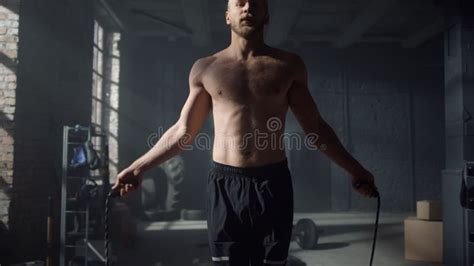 Athlete Jumping On Skipping Rope Man Doing Cardio Workout With Jump