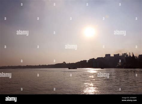 Long View Of Popular Assi Ghat With Several Pilgrims That Stands At The Southernmost Part Of