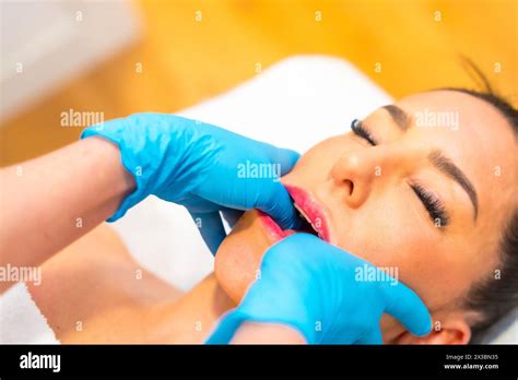 Patient Receiving A Jaw Massage For To Treat Tensions And