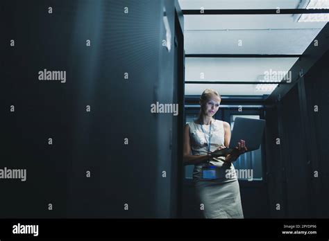 It Engineer Standing Before Working Server Rack Doing Routine Maintenance Check And Diagnostics