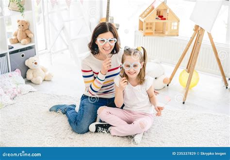 Girl And Mother Holding Stick Glasses Stock Image Image Of Happy Daughter 235337829