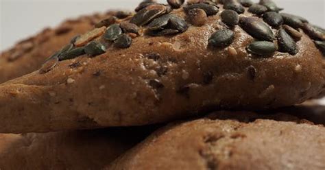 Rotating Dark Buns On A White Background Bakery Products With Grains