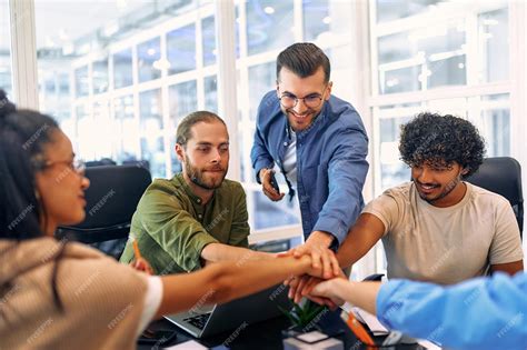 Premium Photo Multiracial Creative People In Office With Their Hands