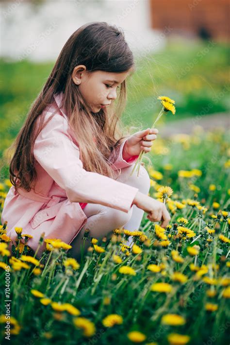 Happy Girl In Field Of Flowers
