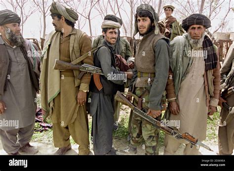 Afghan Mujahideen Guerrilla Fighters Prepare To Depart On A Patrol