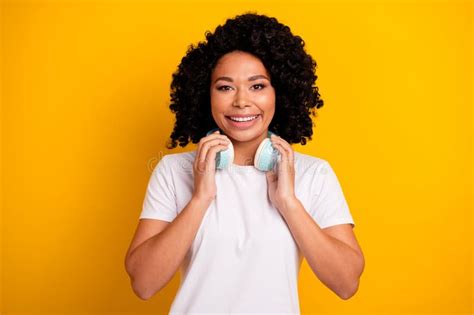 Photo Of Shiny Cute Lady Dressed White T Shirt Enjoying Music Headphones Isolated Yellow Color