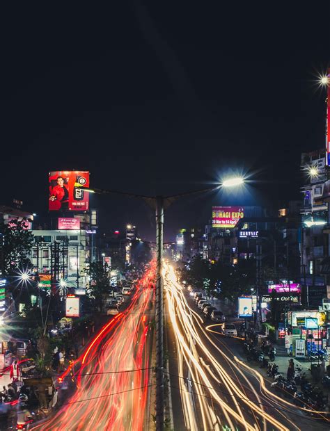 Time Lapse Photo Of Cars Passing By Road During Nighttime · Free Stock