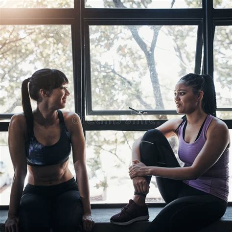 Catching Up After Our Workout Two Friends Chatting While Out For A