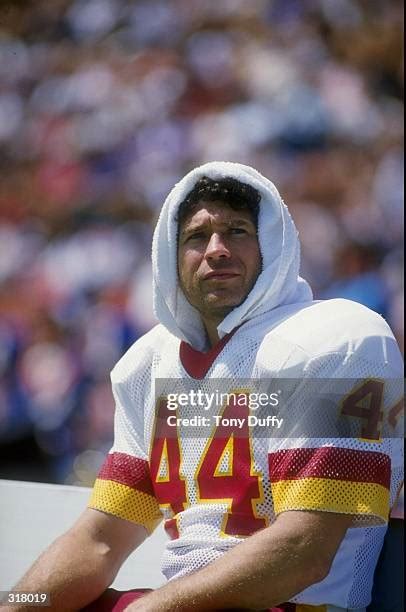 Running Back John Riggins Of The Washington Redskins Looks On During