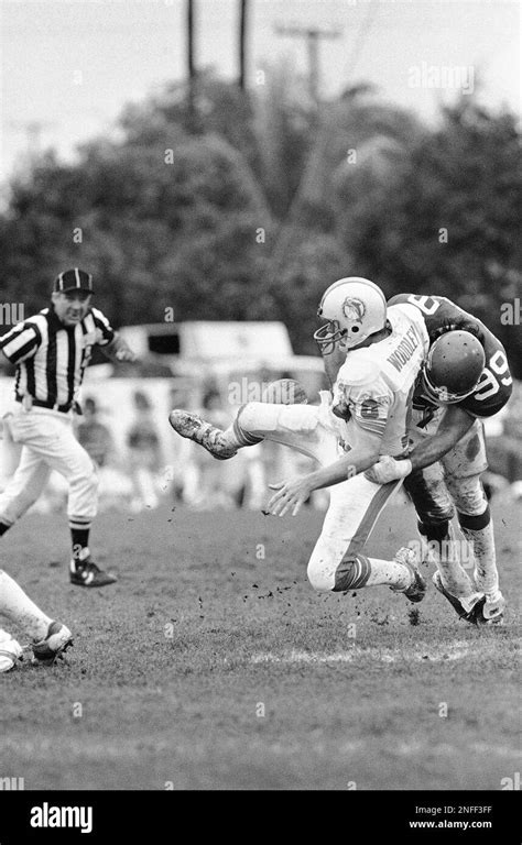 Miami Dolphins Quarterback David Woodley Is Sacked By New York Jets Mark Gastineau 99 During