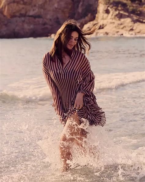 At 60 Monica Bellucci Turns Heads In Bold New Beachwear Shoot — Behind