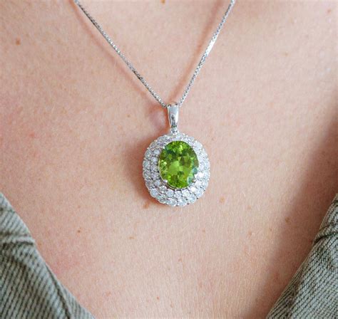 5 03 Carat Oval Peridot Pendant With Round Cut Diamond Halo In 18k
