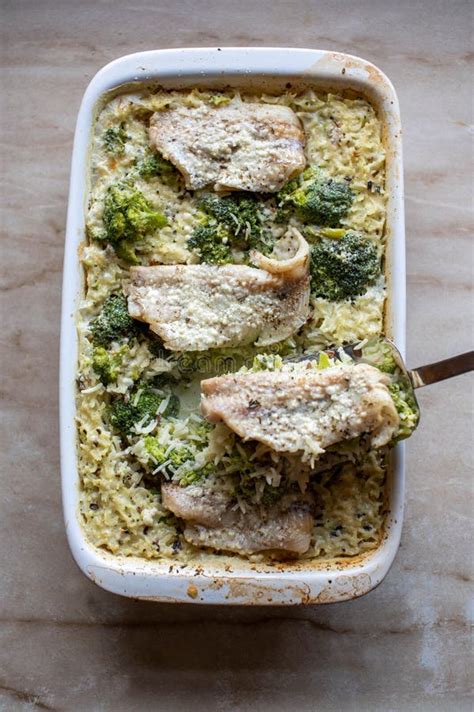 Baked Fish With Rice And Broccoli In A Casserole Dish Stock Image