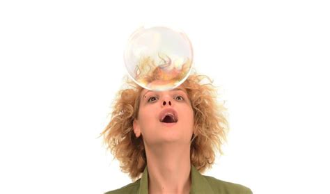 Premium Photo Young Female Model Blowing Soap Bubbles