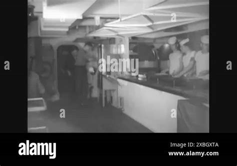 Enlisted Men Going Through Chow In The Mess Hall Aboard The Uss Siciliy