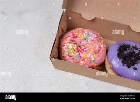Delicious Sweet Donuts With Different Flavors In Small Paper Box