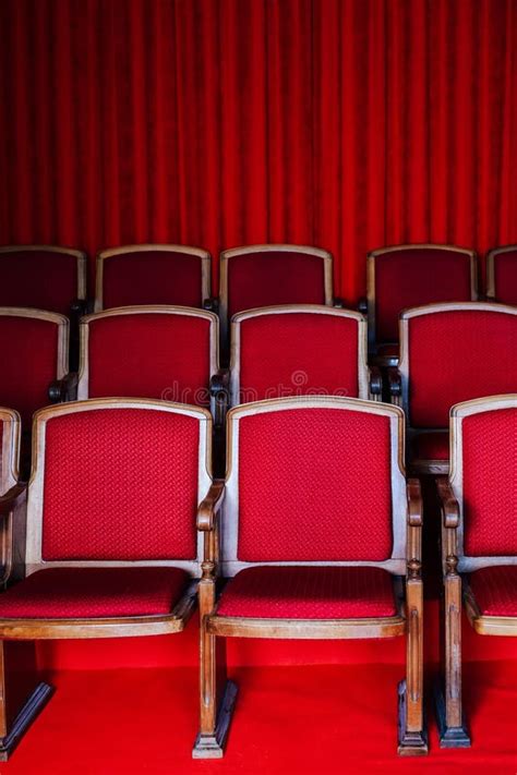 Elegant Red Theater Seating Arranged In Perfect Rows For An Upcoming