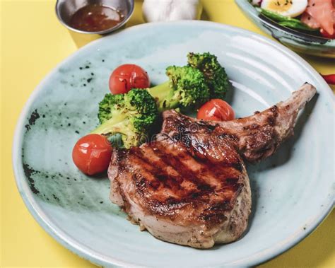 Served Roast Beef Meat Steak With Brocoli Cabbage And Cherry Toamtoes