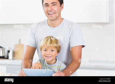 Happy Father Son Using Tablet Hi Res Stock Photography And Images Alamy