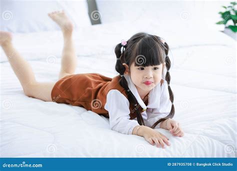 Asian Young Little Cute Preschooler Daughter Girl Laying Down On White