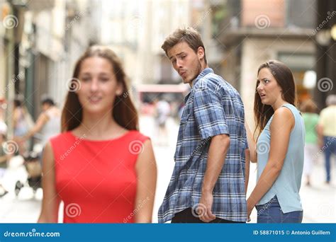 Disloyal Man With His Girlfriend Looking At Another Girl Stock Image