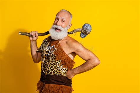 Photo Of Crazy Caveman Feel Positive Hold Tool Weapon On Shoulder Wear