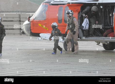 Kaiden Lambert 7 Exits An Sh 60 Seahawk Helicopter Used By The Naval