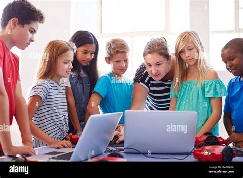 Group Of Students In After School Computer Coding Class Learning To