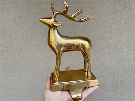 Two Vintage Heavy Brass Stocking Holders Reindeer Mismatched Gold Tone Christmas Decor Mantle