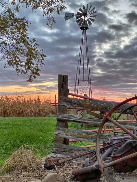 Rustic Windmill And Wooden Fence