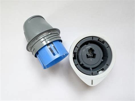 Close Up Of Glucose Monitoring Sensor And Applicator On White