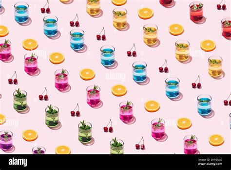 Summer Cocktail Pattern With Drinking Glasses Slices Of Orange And Cherries On Pink Background