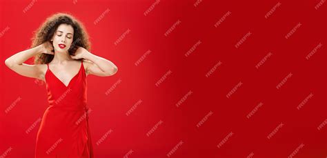 Premium Photo Indoor Shot Of Relaxed Woman Messaging Back Of Neck With Closed Eyes And Calm