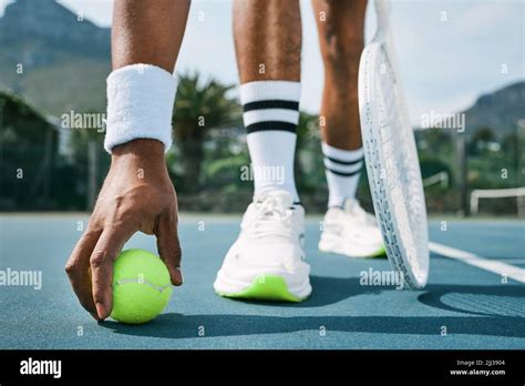 leave it on the court an unrecognizable man bending down to pick up a