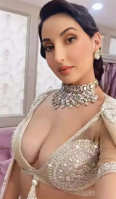 New Pictures Of Nora Fatehi In A Thigh High Slit Lehenga With A