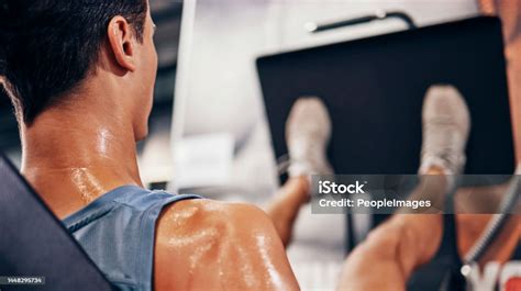 Fitness Man Sweating Using Leg Press For Workout Health And Wellness