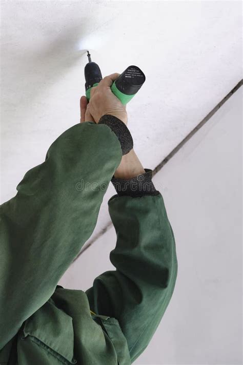 Persons Hands Working With Cordless Screwdriver On Ceiling Stock Image Image Of Decoration