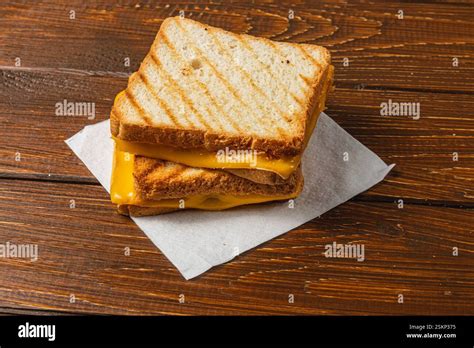 A Perfectly Toasted Grilled Cheese Sandwich With Melted Cheese Oozing