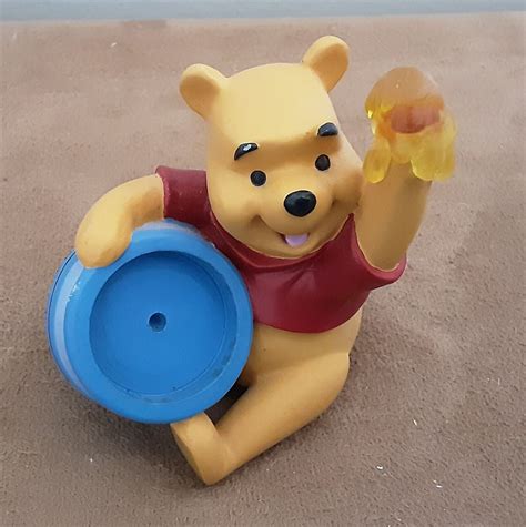 Winnie The Pooh Holding Honey Pot
