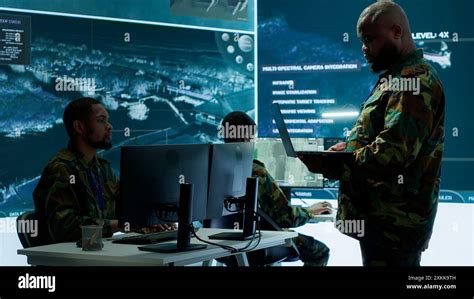 Cybersecurity Team Operates In An Advanced Military Command Center