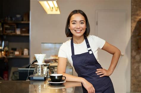 Free Photo Portrait Of Asian Smiling Barista Girl Serving Coffee