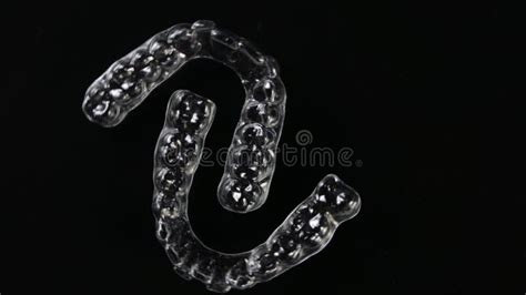 Invisible Orthodontics Cosmetic Brackets On Black Background Tooth