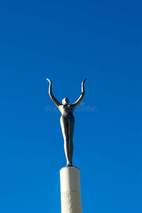 Bronze Statue With Raised Arms Against Blue Sky Stock Image Image Of