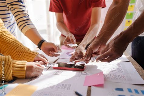 A UX Design Team Is A Confluence Of User Research UX UI Design With Layout Paper On Desk