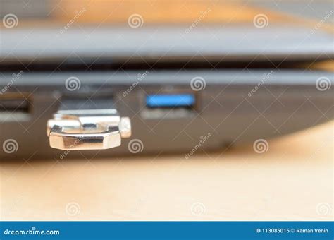 A Metal Flash Drive In The Usb Slot Of A Laptop Close Up Stock Image Image Of Data