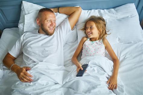 Premium Photo Father And Daughter Sleeping Peacefully Together In A