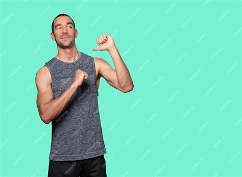 Premium Photo Proud Young Man Making A Haughty Gesture