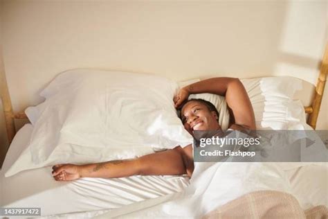Black Woman Stretching In Bed Photos And Premium High Res Pictures