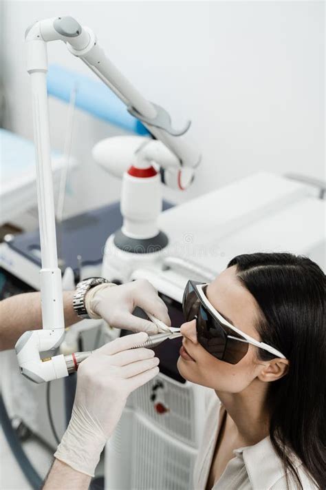 Chronic Rhinitis Treatment With Laser Ent Doctor In Protective Glasses